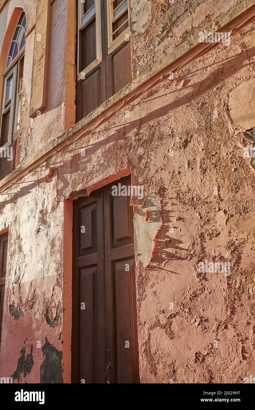 Exterior of an old building with peeling paint. Architecture details of ...