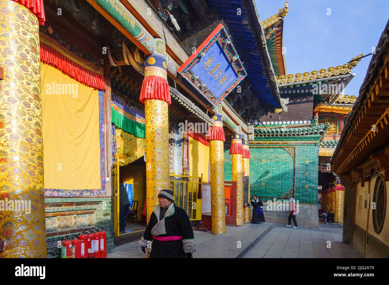 Tibetans worship at one of the temples in Ta'er Monastery in Xining ...