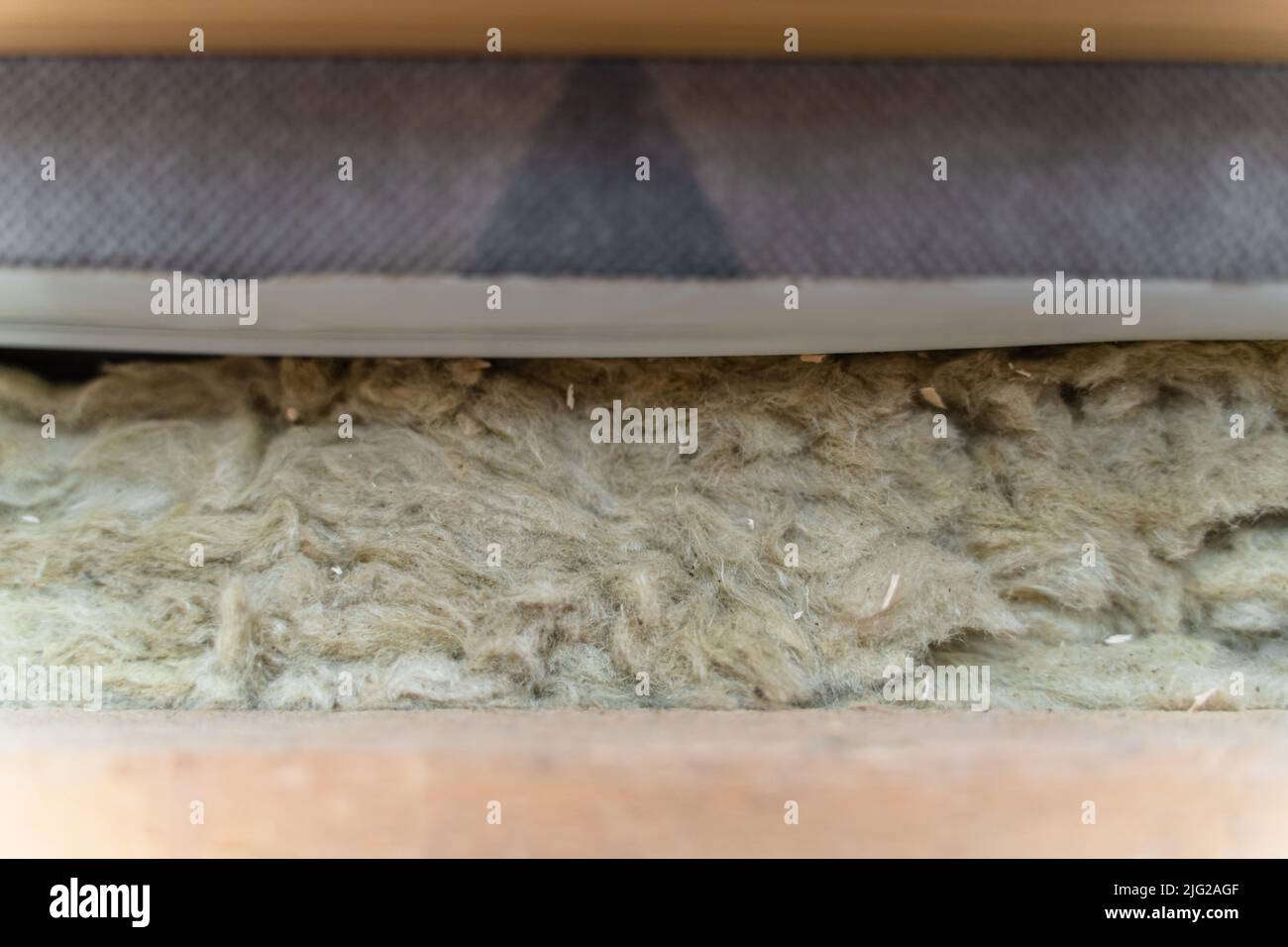 Roof insulation with mineral wool, close-up. Mineral wool between ...