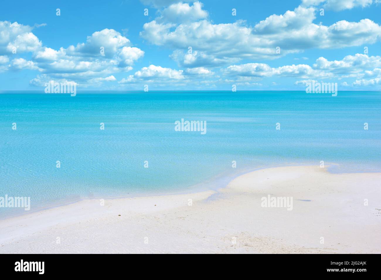 Copy space at the beach with a cloudy blue sky background above the ...