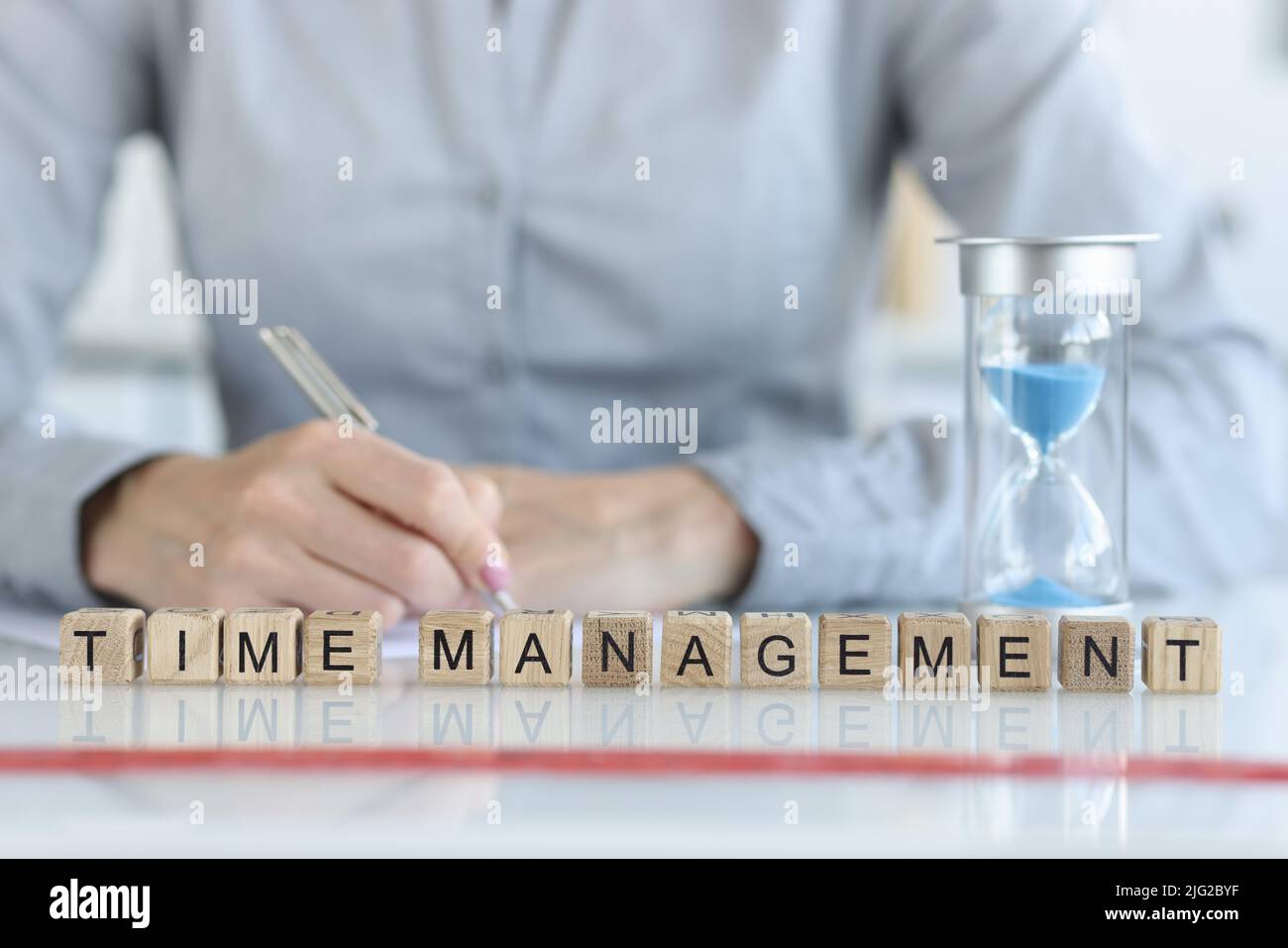 Time management words collected with wooden cubes Stock Photo - Alamy