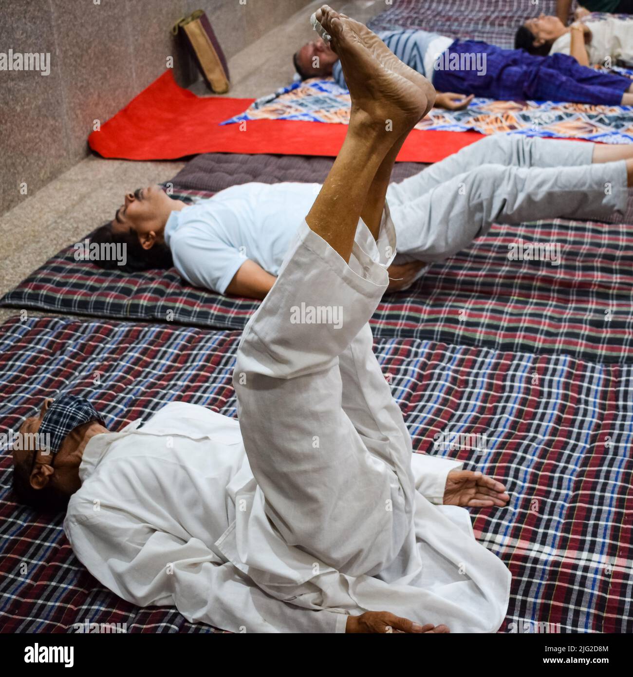 New Delhi, India, June 19 2022 -Group Yoga exercise session for people ...