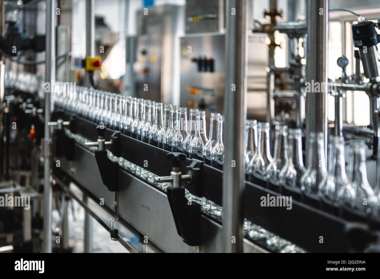 Production line transports empty glass bottles for alcohol Stock Photo ...