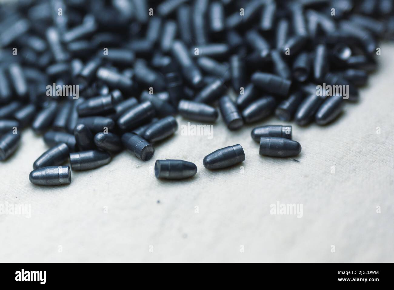 Small caliber hunter bullets lie on light fabric sheet Stock Photo - Alamy
