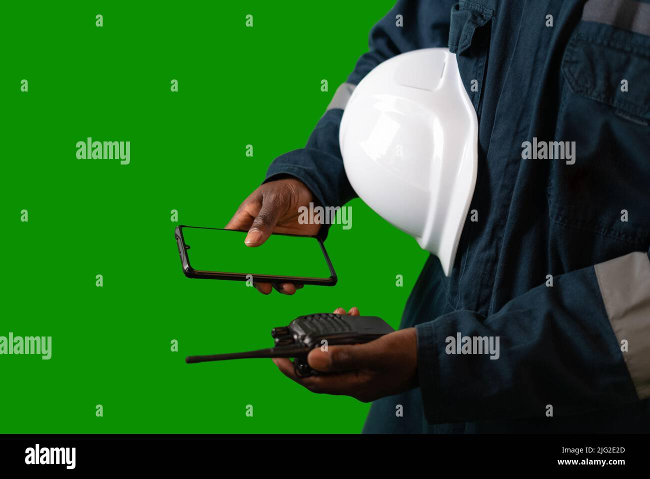 Crop black seafarer with smartphone and VHF radio Stock Photo - Alamy