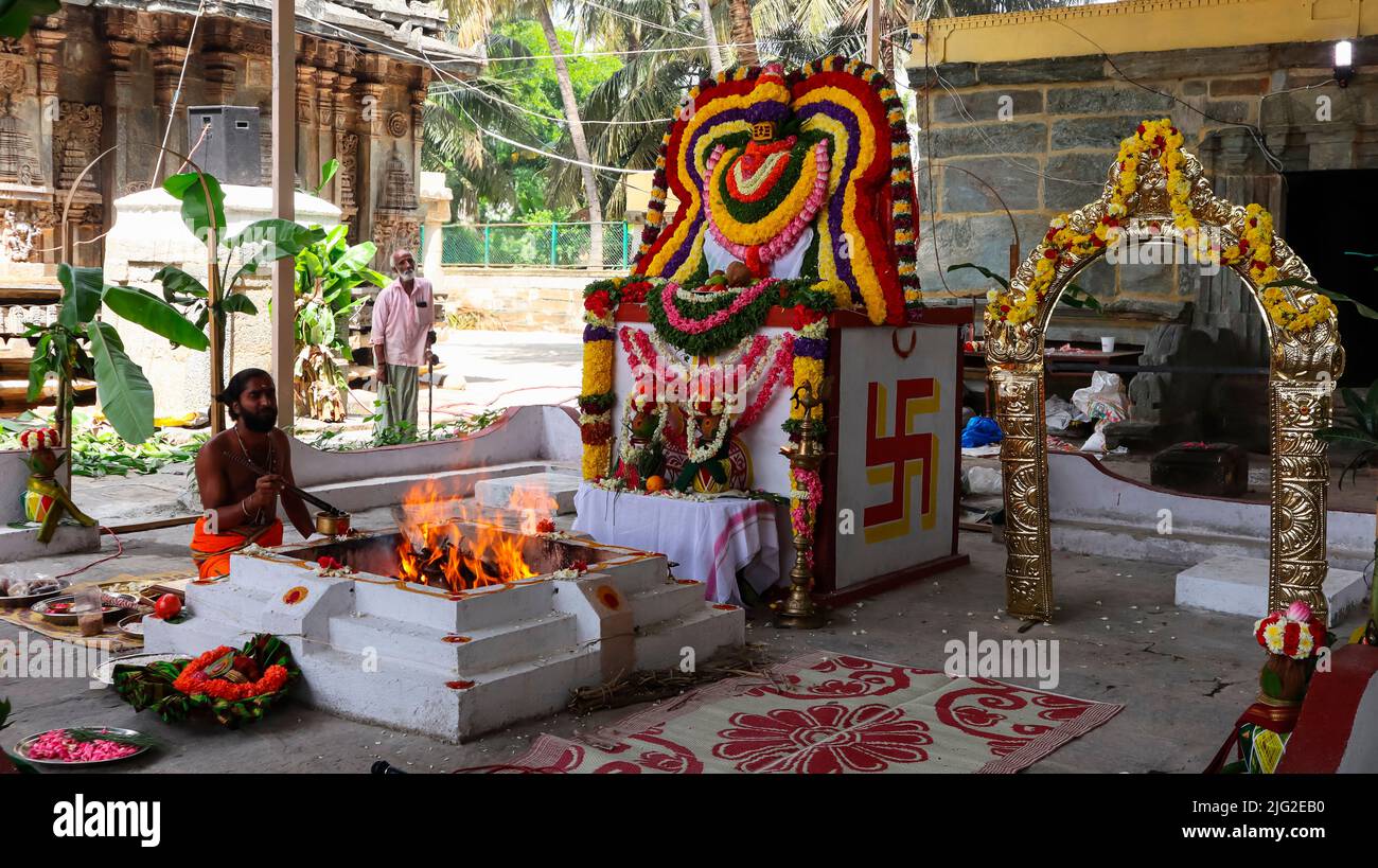 INDIA, KARNATAKA, MANDYA, KIKKERI, June 2022, Hindu Priest performing ...