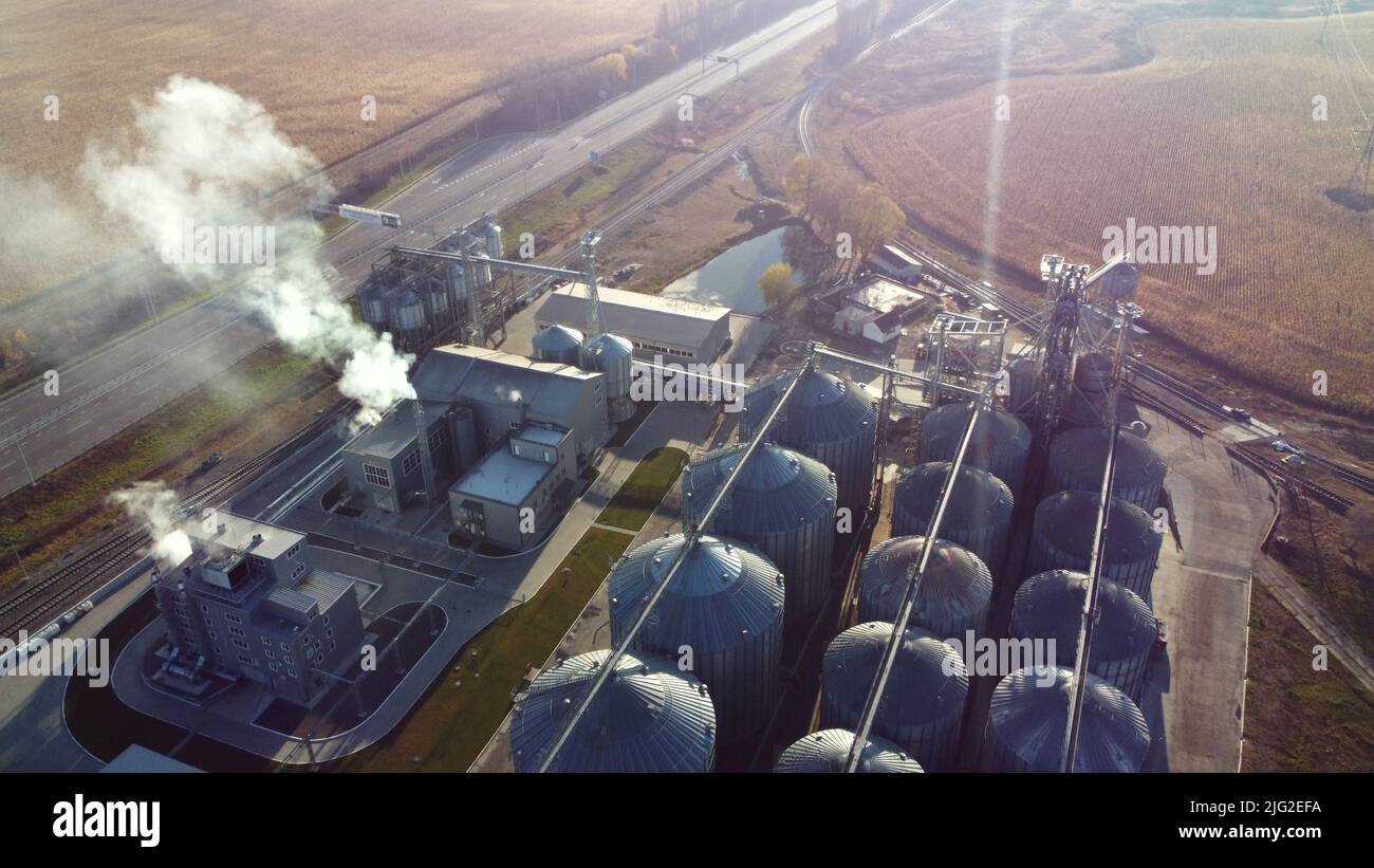 Aerial Drone View Flight Over complex of grain elevator buildings ...