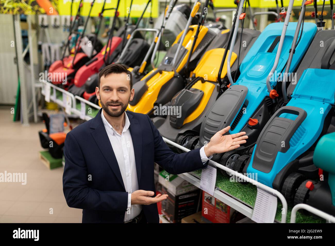 garden equipment store manager offers a wide range of lawn mowers Stock ...