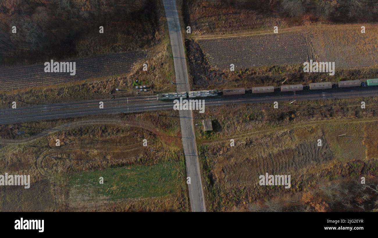 Top View Freight Train Passing Railway Crossing. Aerial Drone View ...