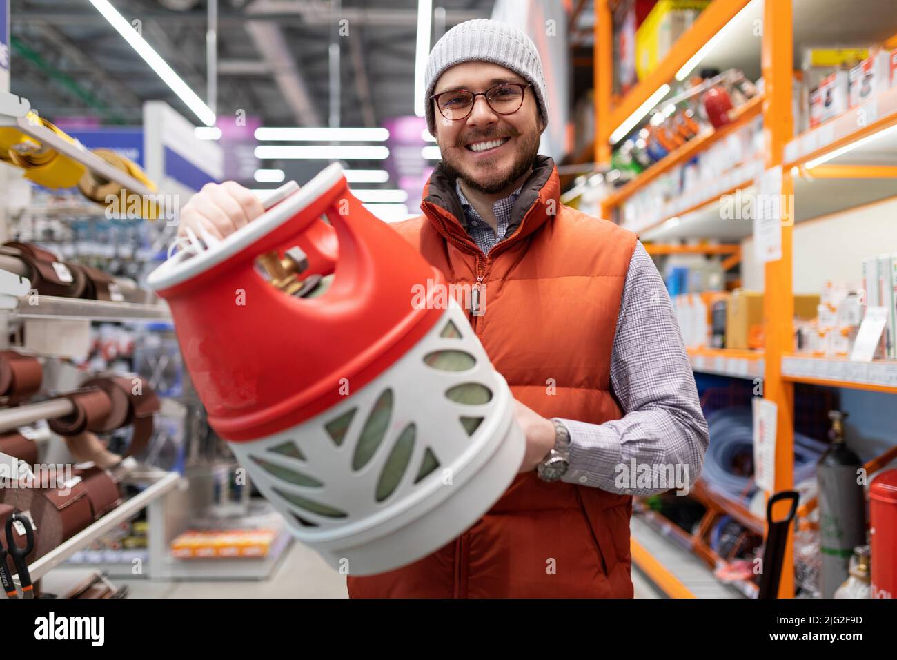 happy customer with a gas cylinder in his hands Stock Photo - Alamy