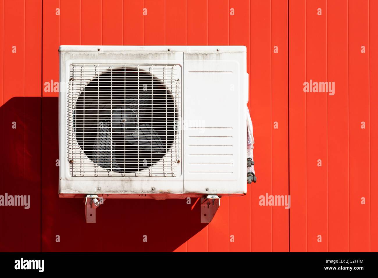 outdoor air conditioner unit on the wall of a building Stock Photo - Alamy