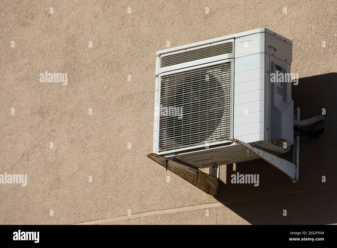 old outdoor air conditioner unit hanging outside the building Stock ...