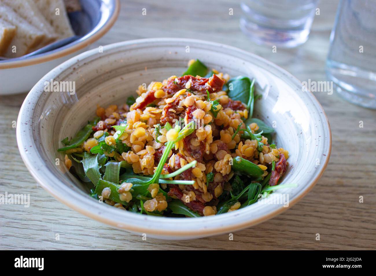 Lean seeds with dry tomatoes and spinach Stock Photo - Alamy