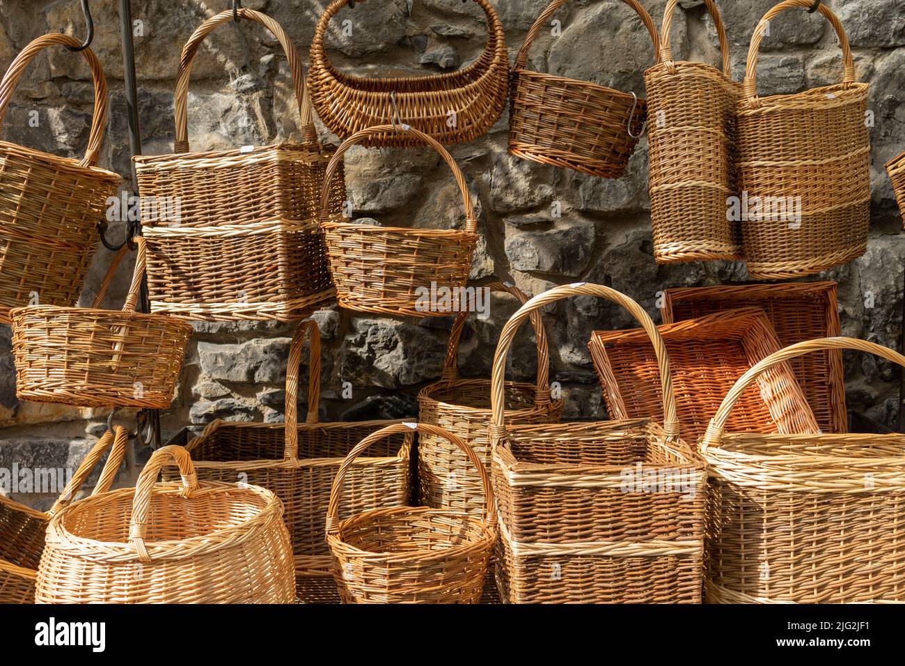 Many different wicker baskets made of natural material as background ...