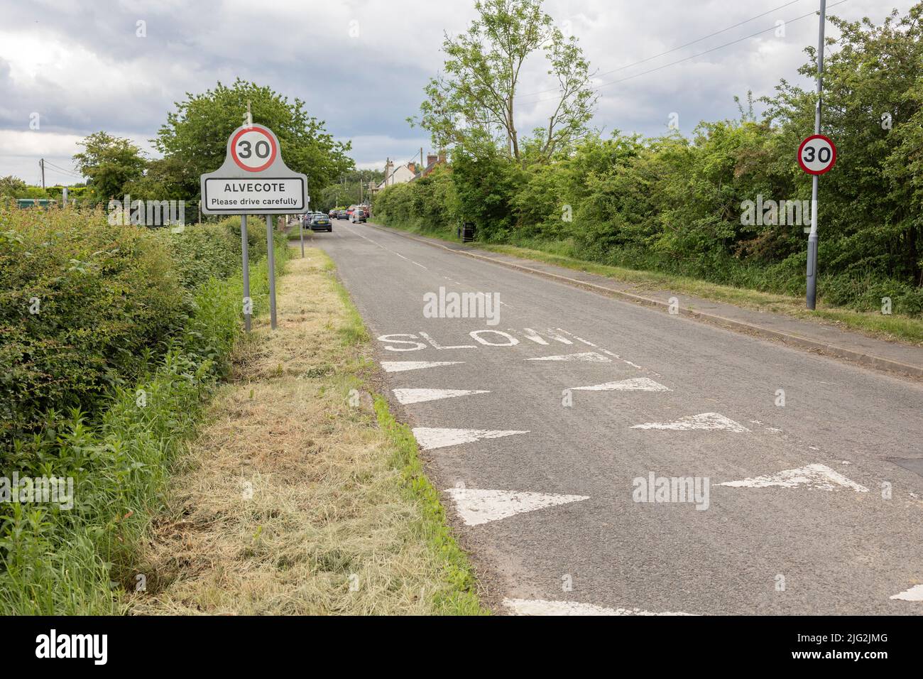 Thirty mile per hour street sign with village name Stock Photo - Alamy
