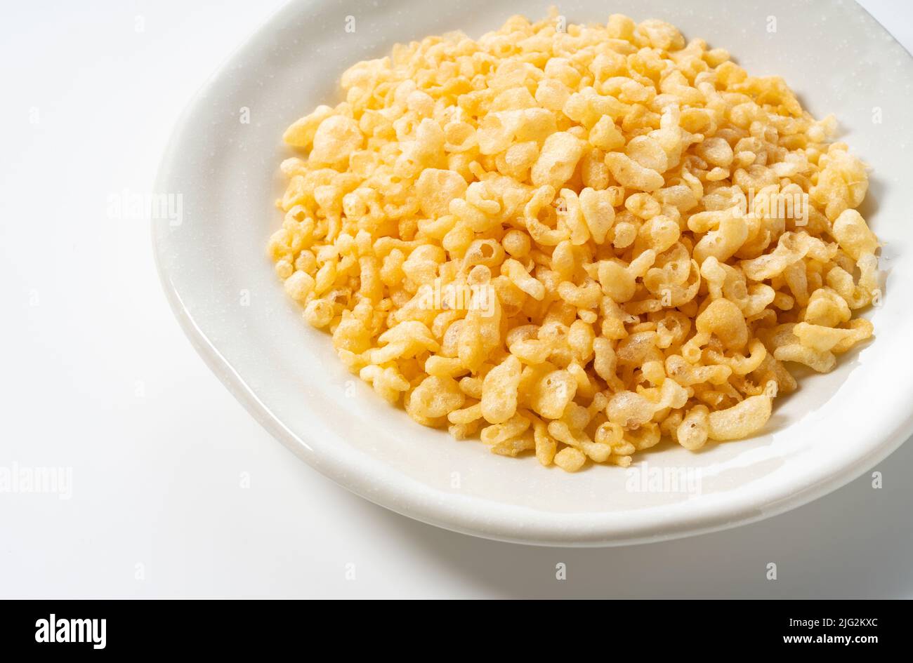 Tenkasu served on a plate placed on a white background. Image of ...