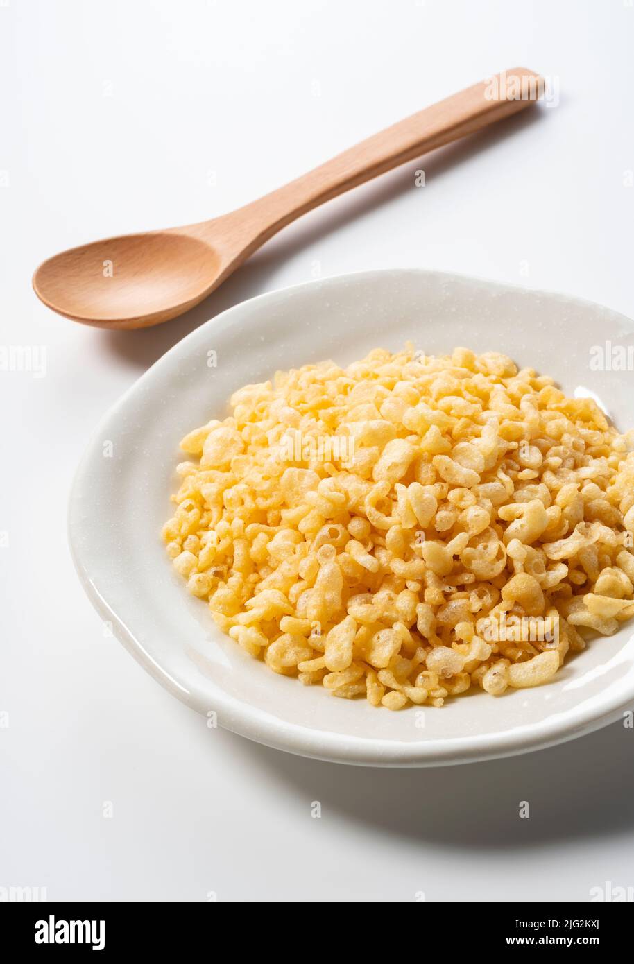 Tenkasu served on a plate placed on a white background. Image of ...