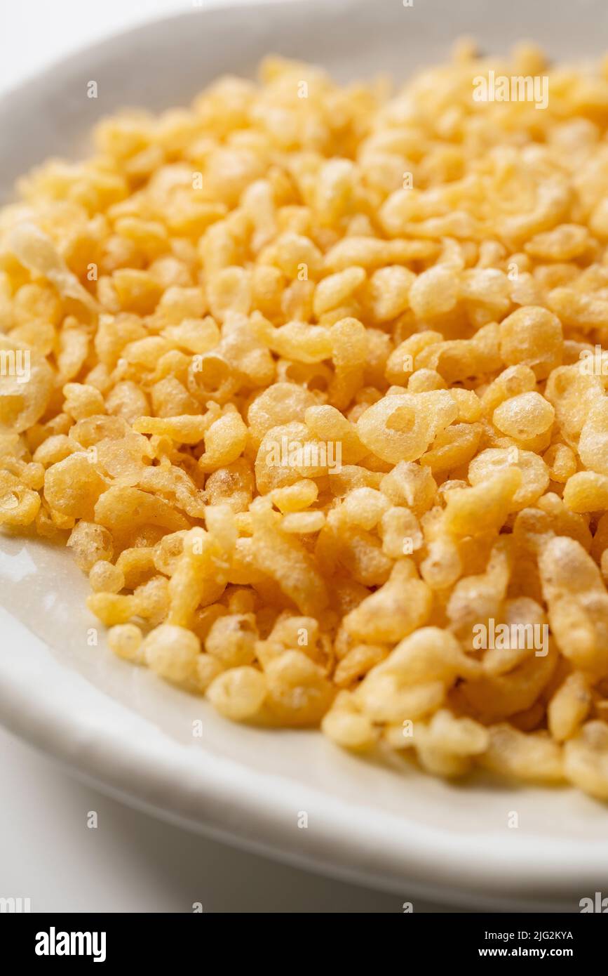 Tenkasu served on a plate placed on a white background. Image of ...