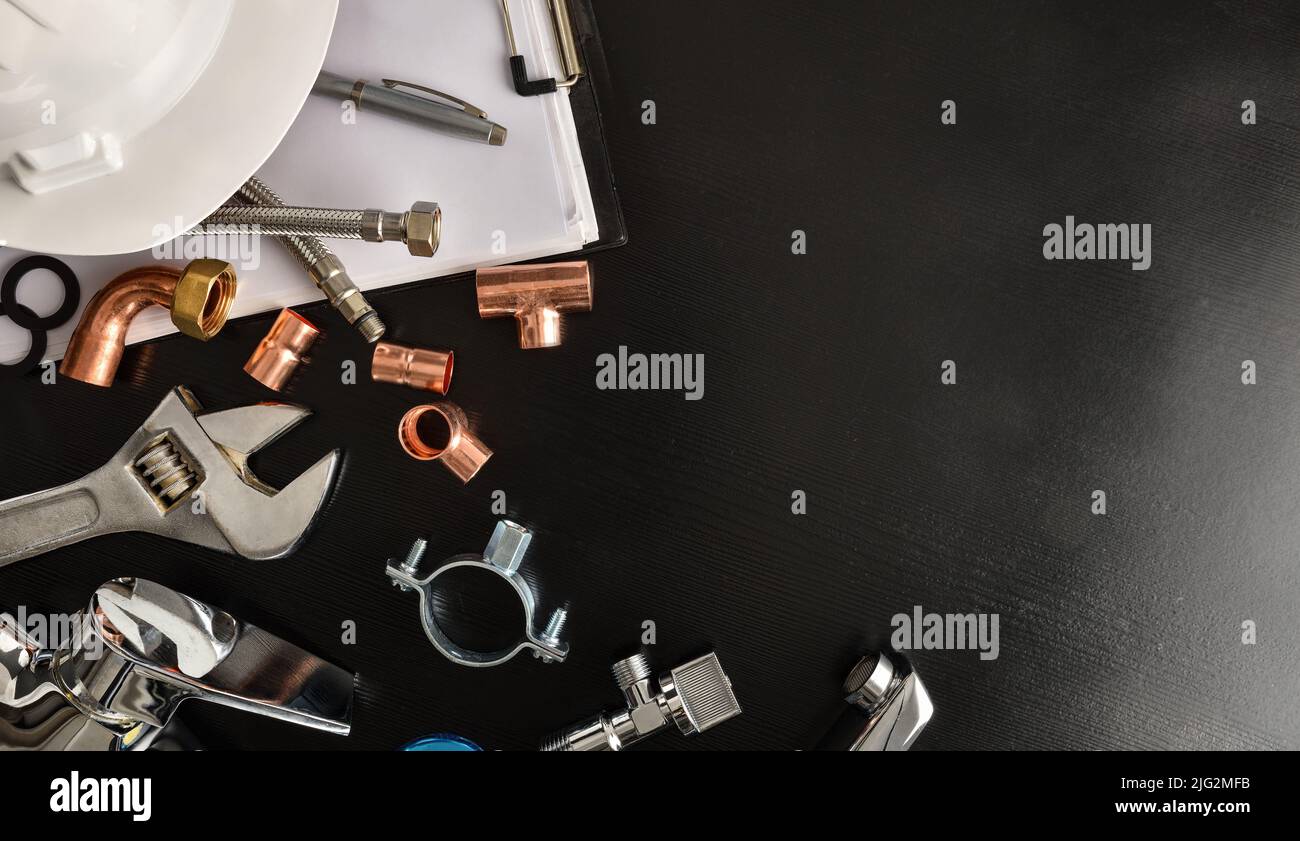 Professional home maintenance background with tools and notepad on ...