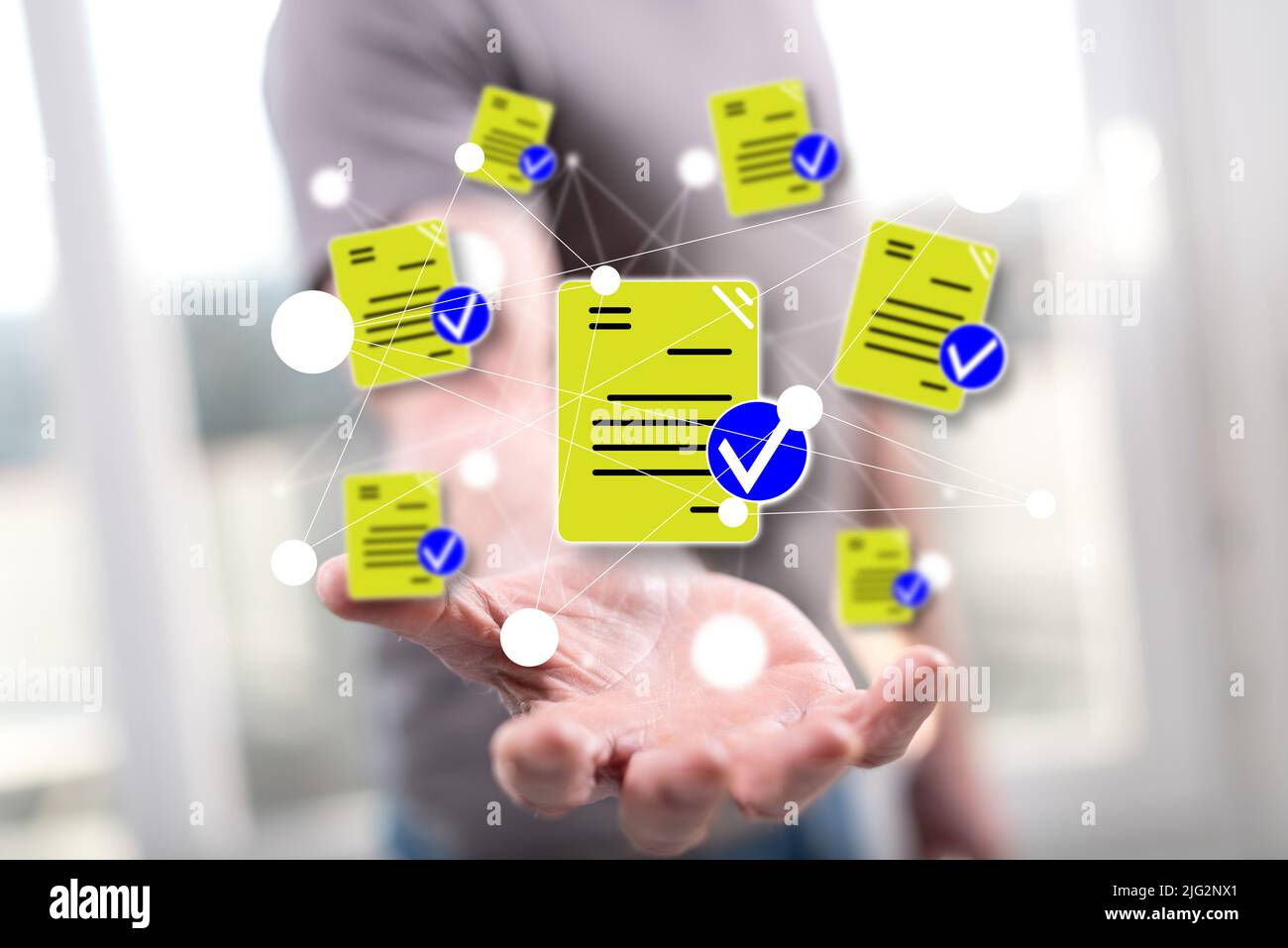 Document validation concept above the hand of a man in background Stock ...
