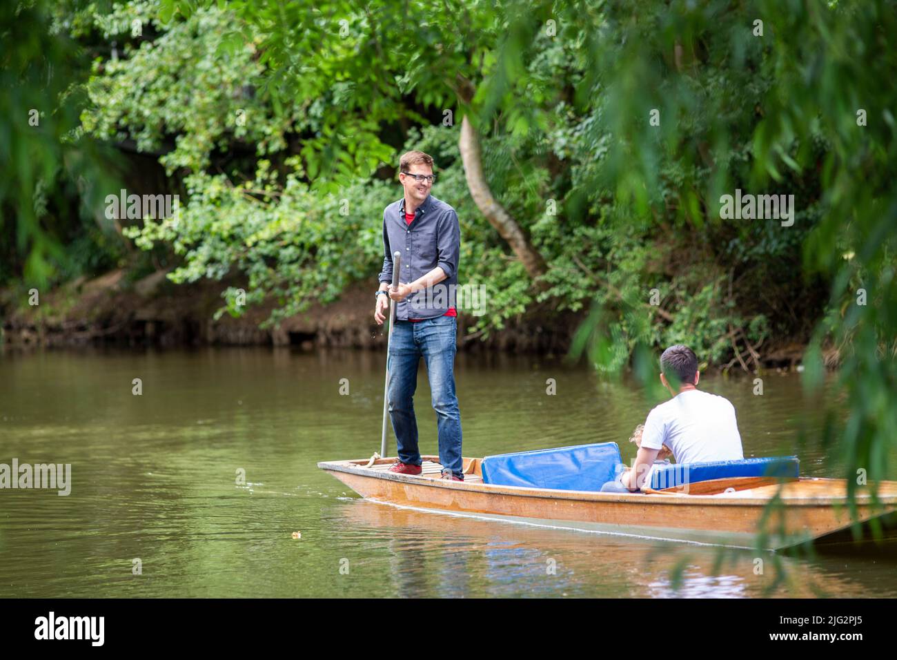 Punting on a summers evening on the River Churwell , Oxford, England ...