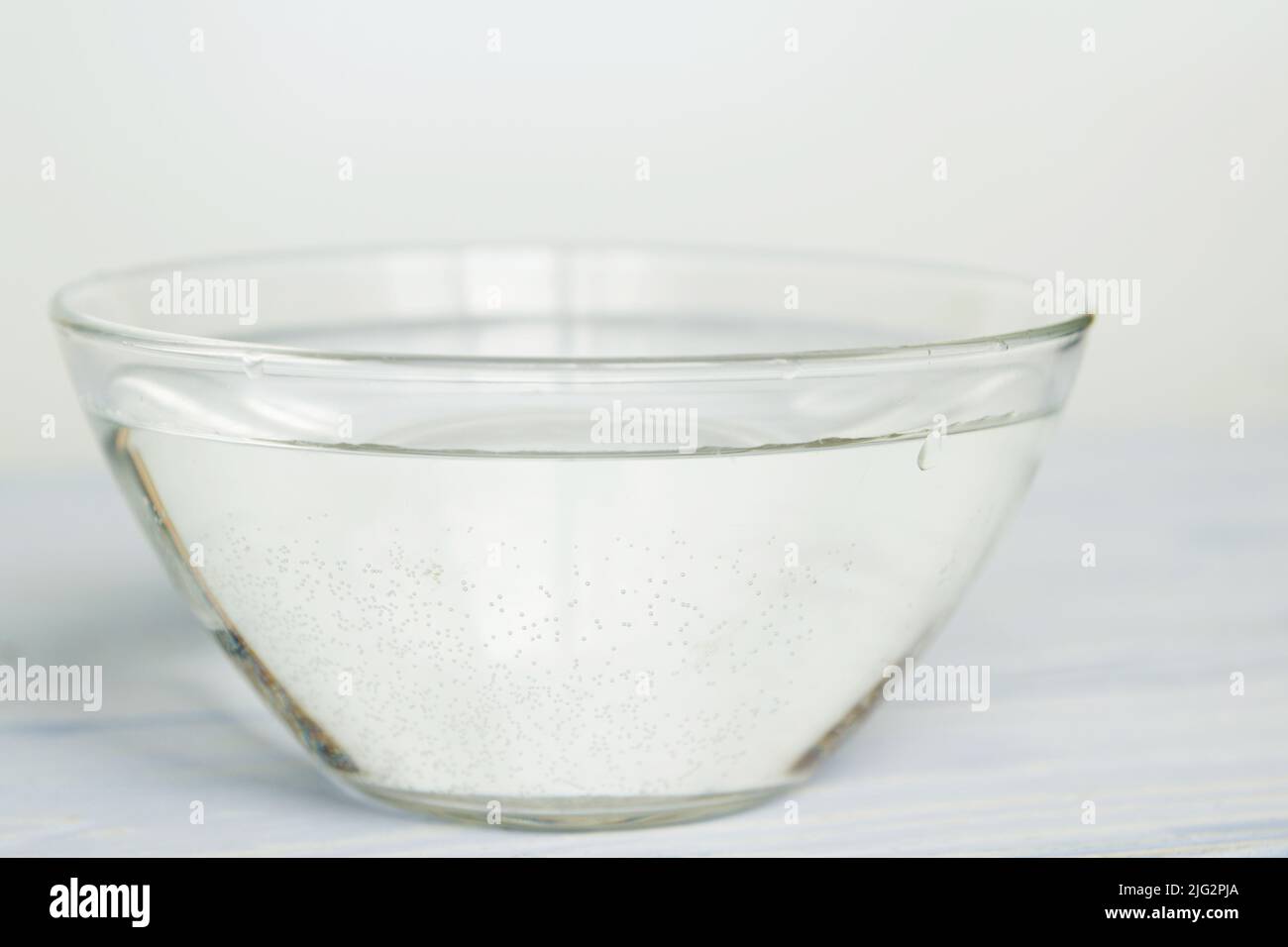 water in a bowl on a white background Stock Photo - Alamy