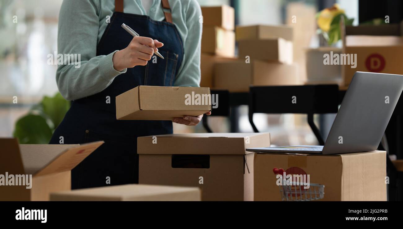 Image of Young asian woman startup freelance with product and showing ...