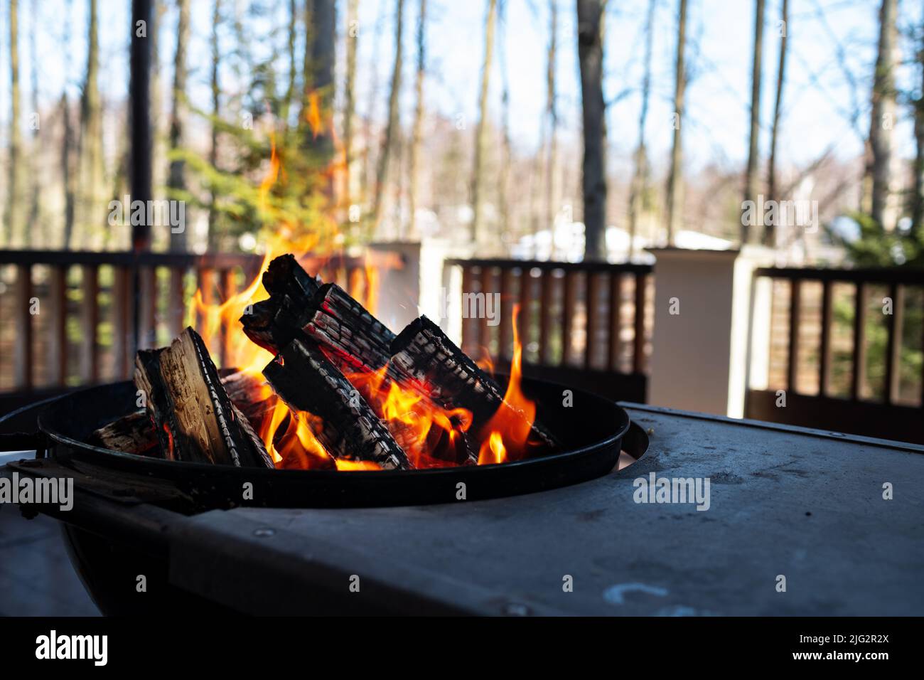 Barbecue grill with fire on open air close up Stock Photo - Alamy