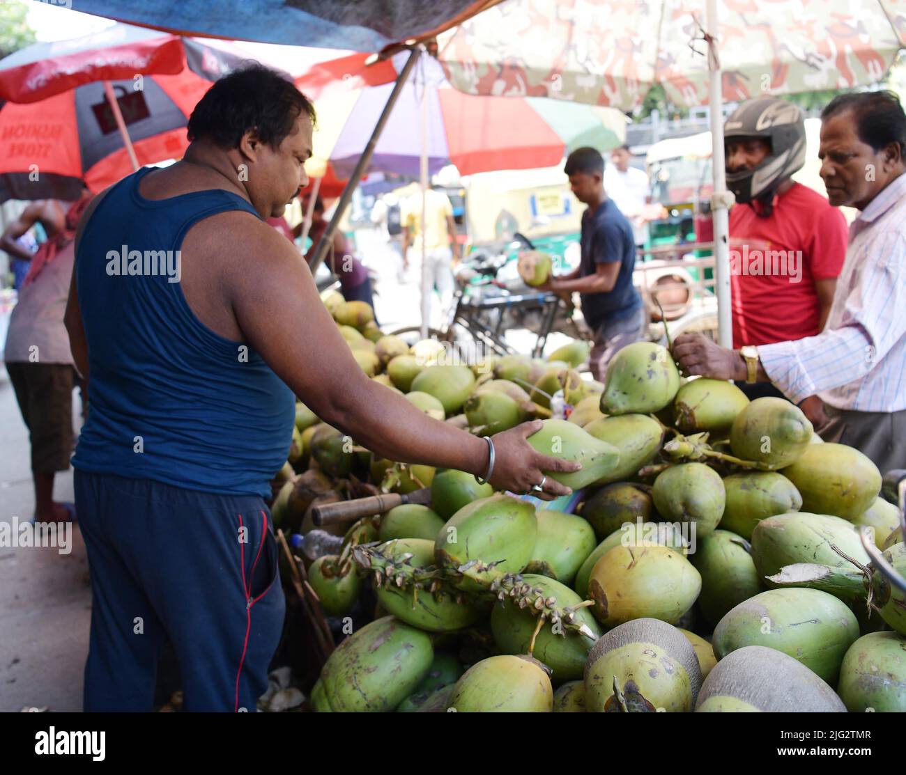 Coconut water drinking indian young hi-res stock photography and images ...