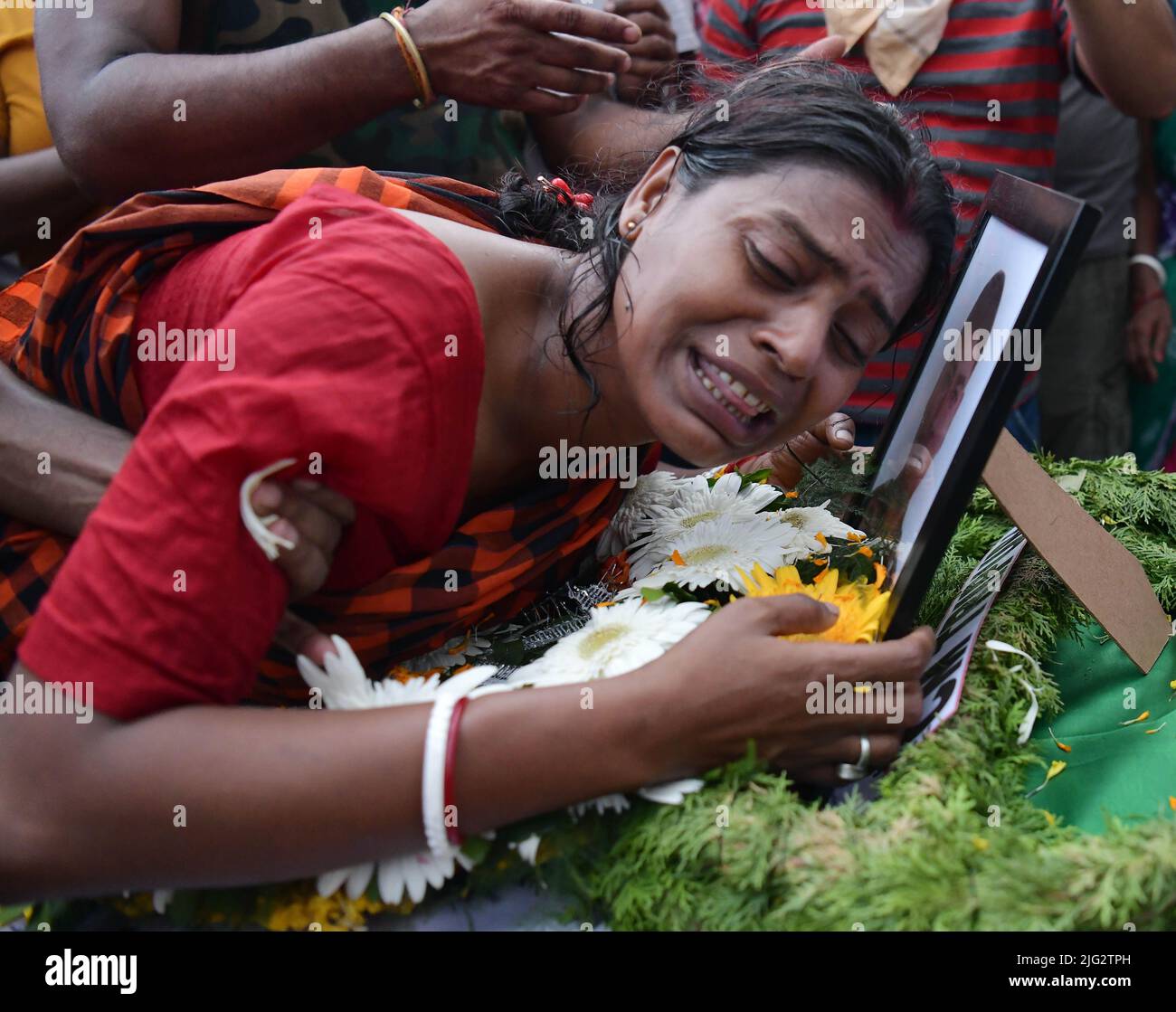 Family members mourn the death of Army Soldier Prashanta Deb, who was ...