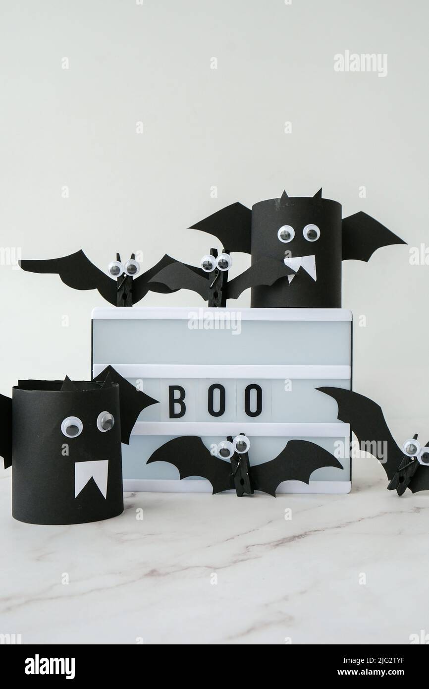 Lightbox with text BOO around paper bats. Halloween party decoration ...