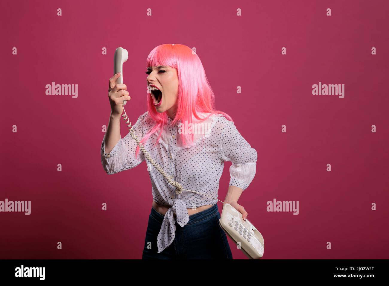Crazy funky person screaming at landline phone call on camera, posing ...