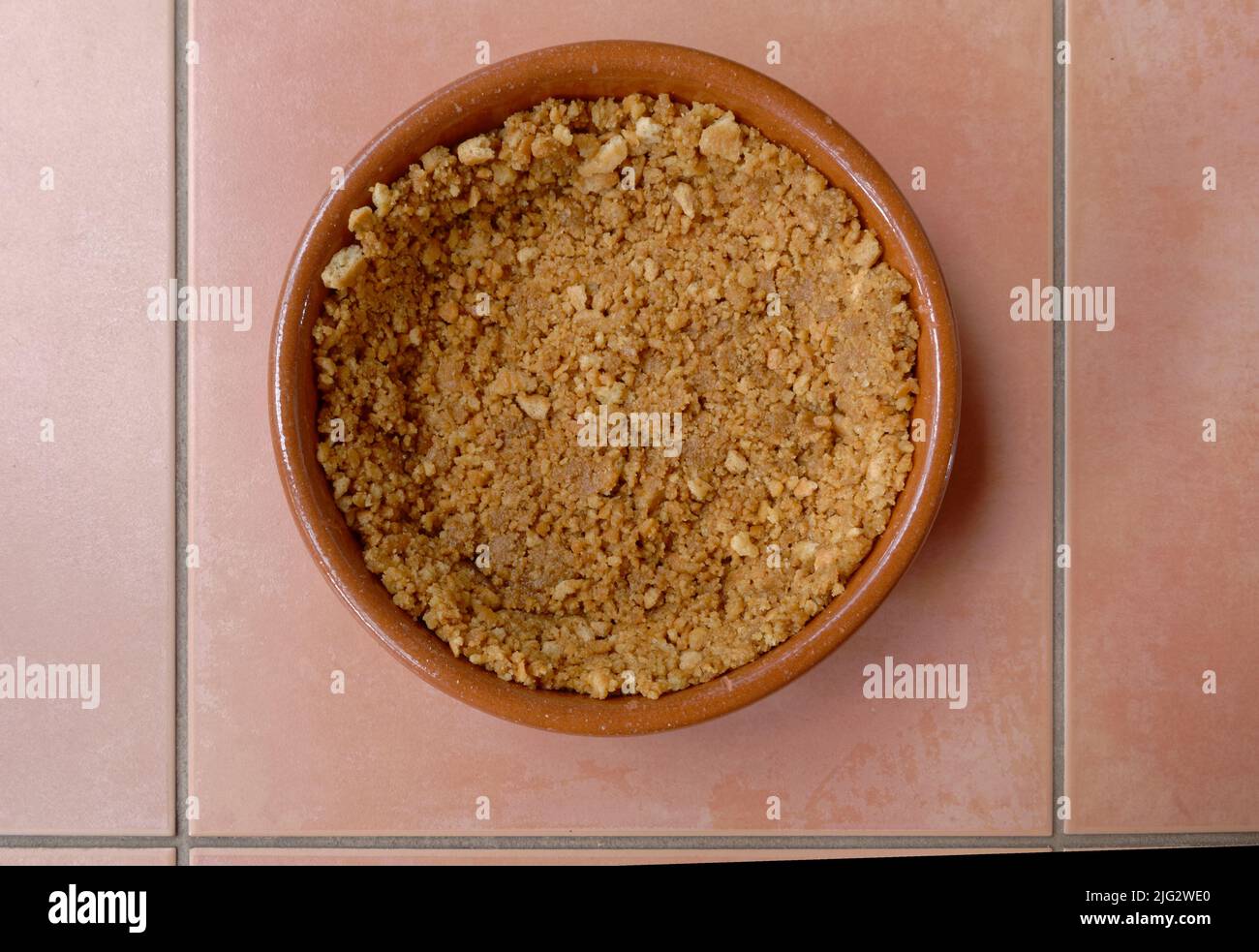 A biscuit base is waiting for its filling, it is the start of a ...