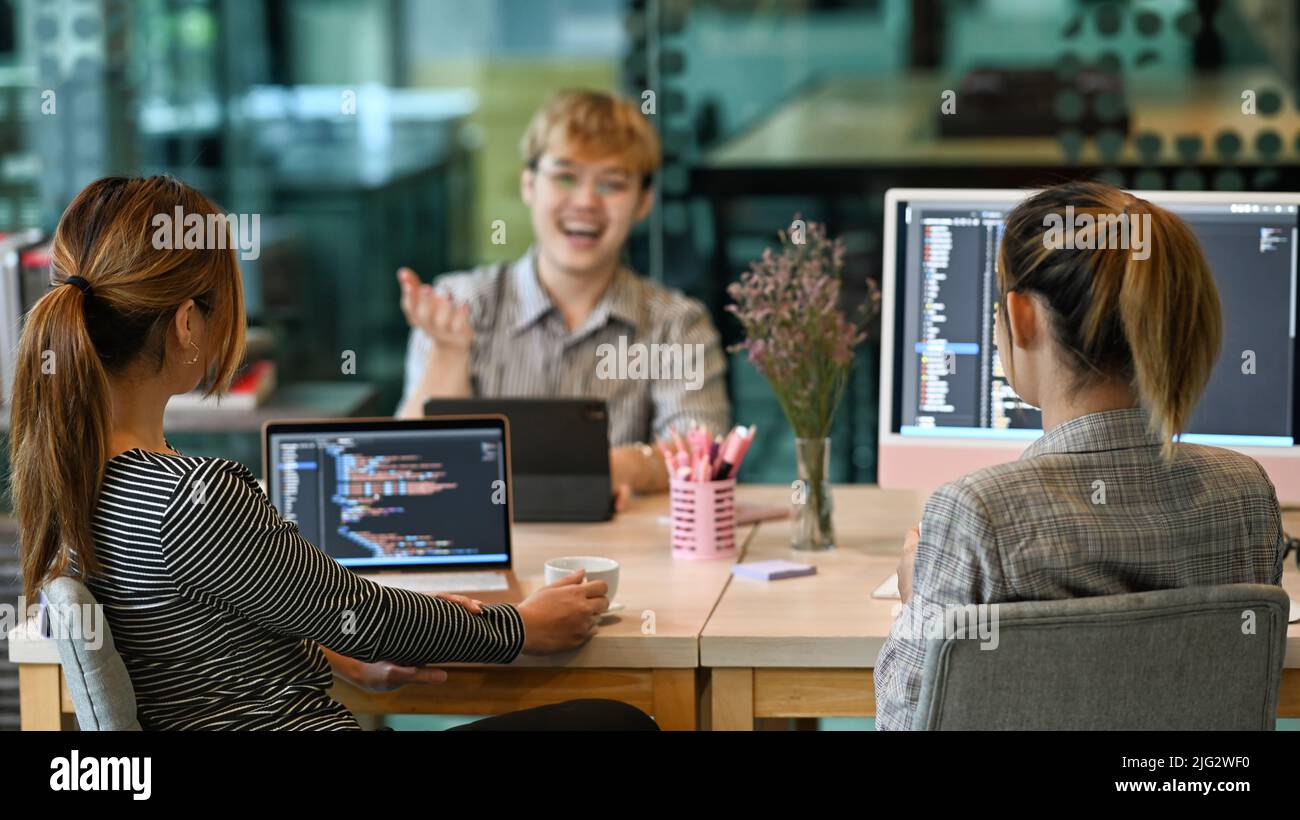 Group of software developers brainstorming and discussion for ...