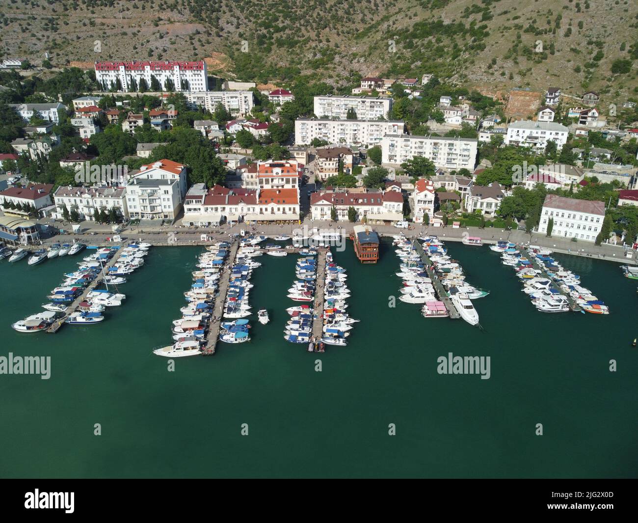 Aerial panoramic view of Balaklava landscape with boats and sea in ...