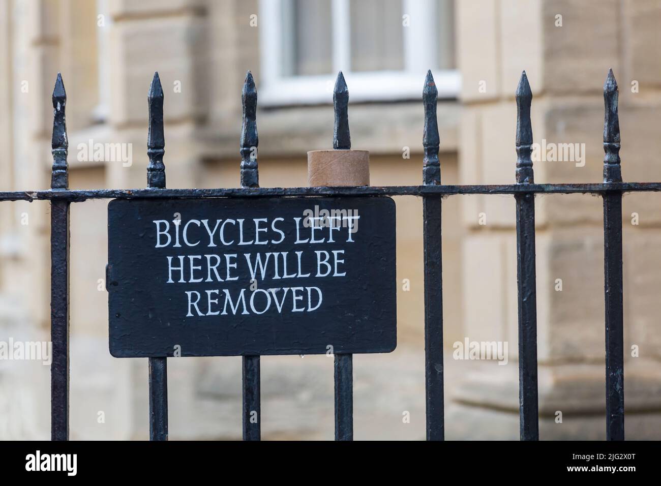 Bicycles left here will be removed sign on railing at Oxford ...