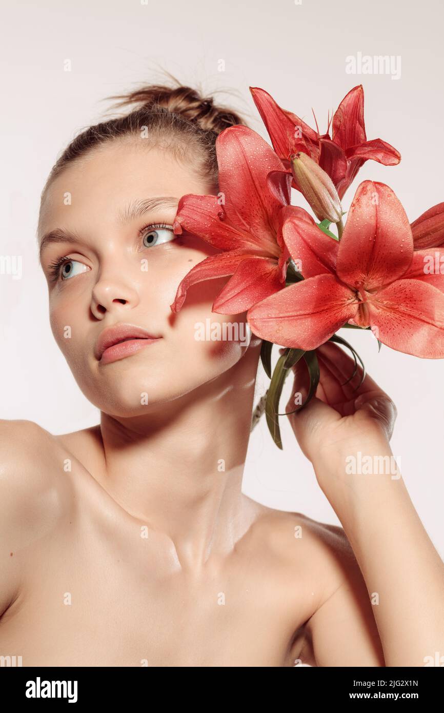 Blossom Close Up Portrait Of Beautiful Young Girl With Flower Isolated