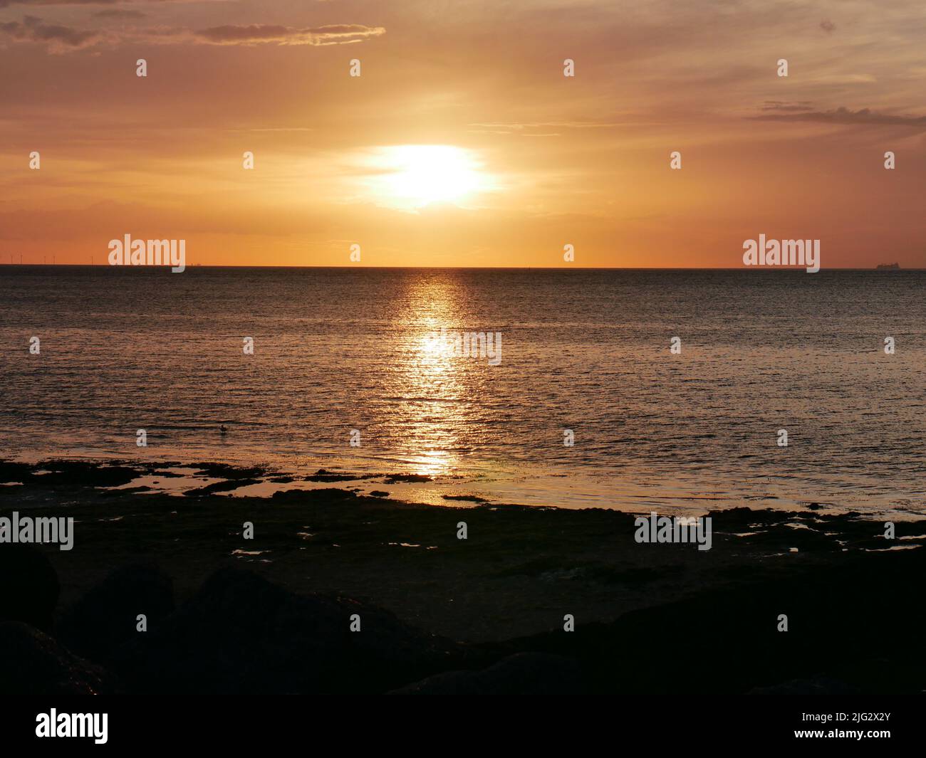 Sunset on Margate beach Stock Photo - Alamy