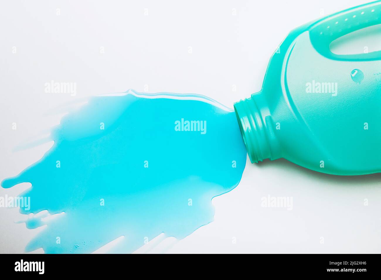Blue liquid detergent spilled on the table, isolated on white Stock ...