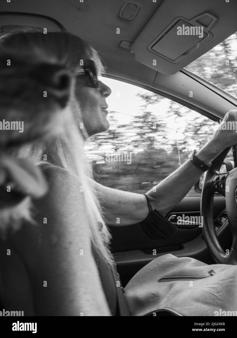 Happy young woman car Black and White Stock Photos & Images - Alamy