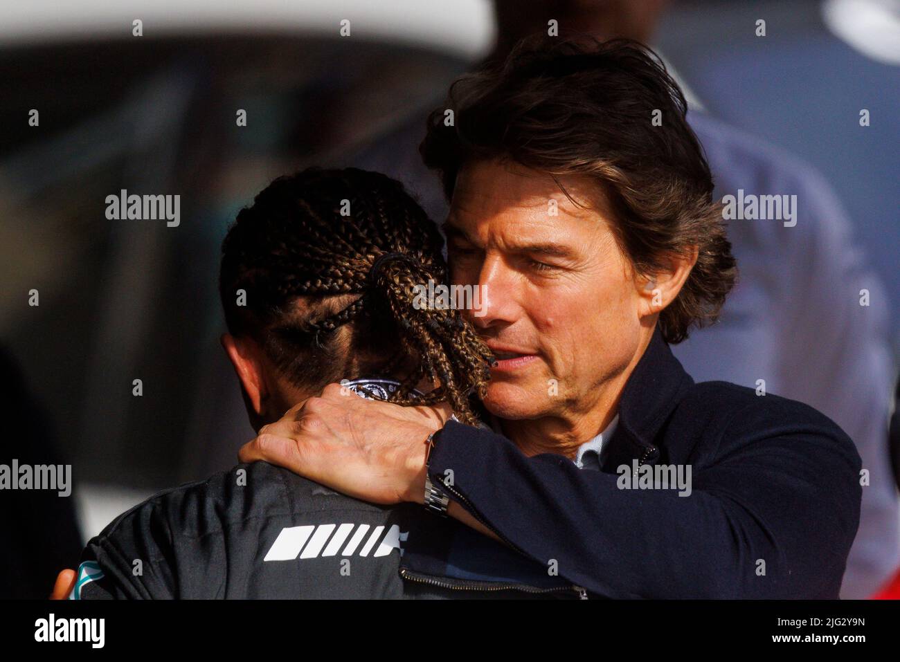 Tom Cruise hugs and consoles Lewis Hamilton underneath the podium at ...