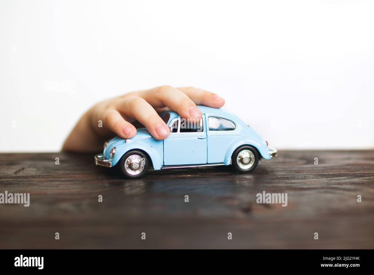 child playing with the car close on a white background Stock Photo - Alamy