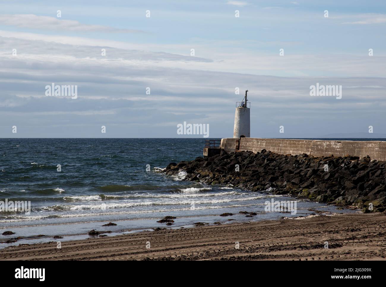 Old harbour light at Girvan harbour entrance in south west Scotland ...