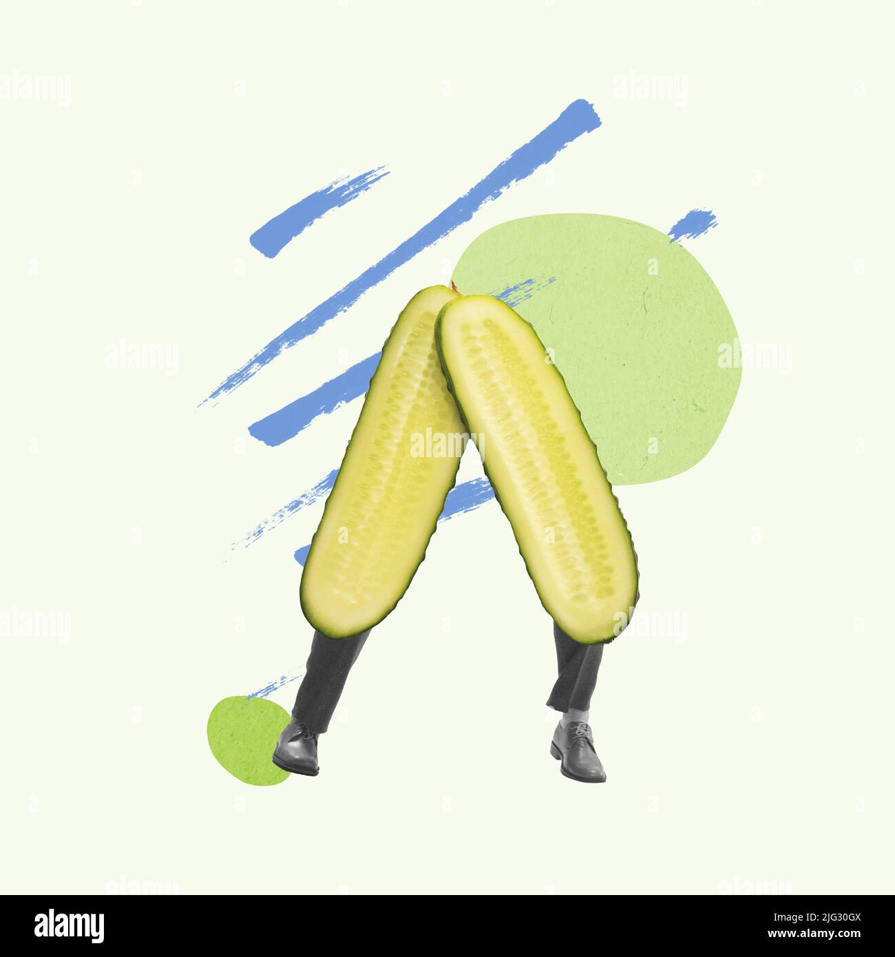 Composition with huge vegetable, cucumber on human legs isolated over ...