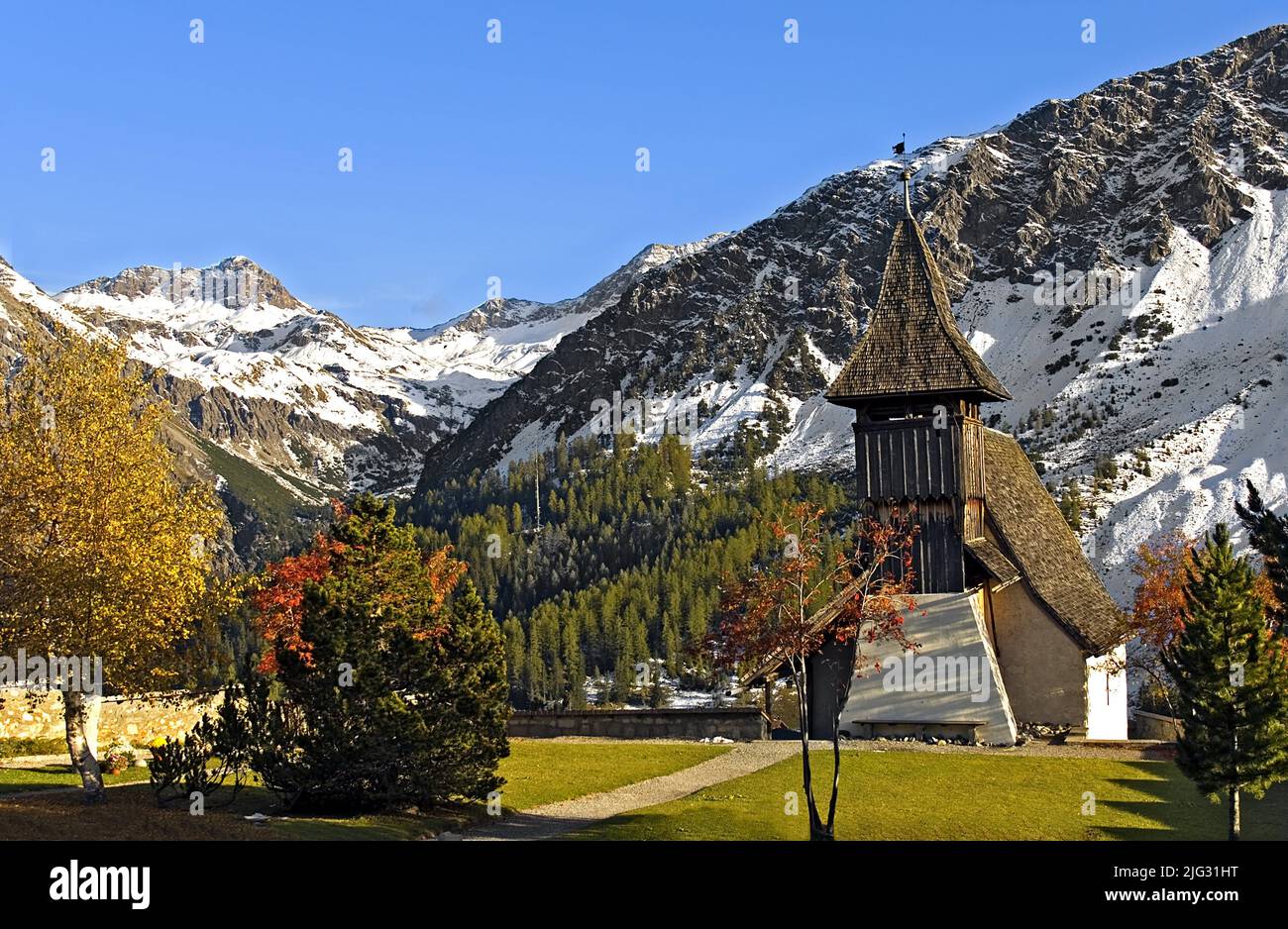 mountain church in Swiss Alps in autumn, Switzerland, Arosa Stock Photo ...