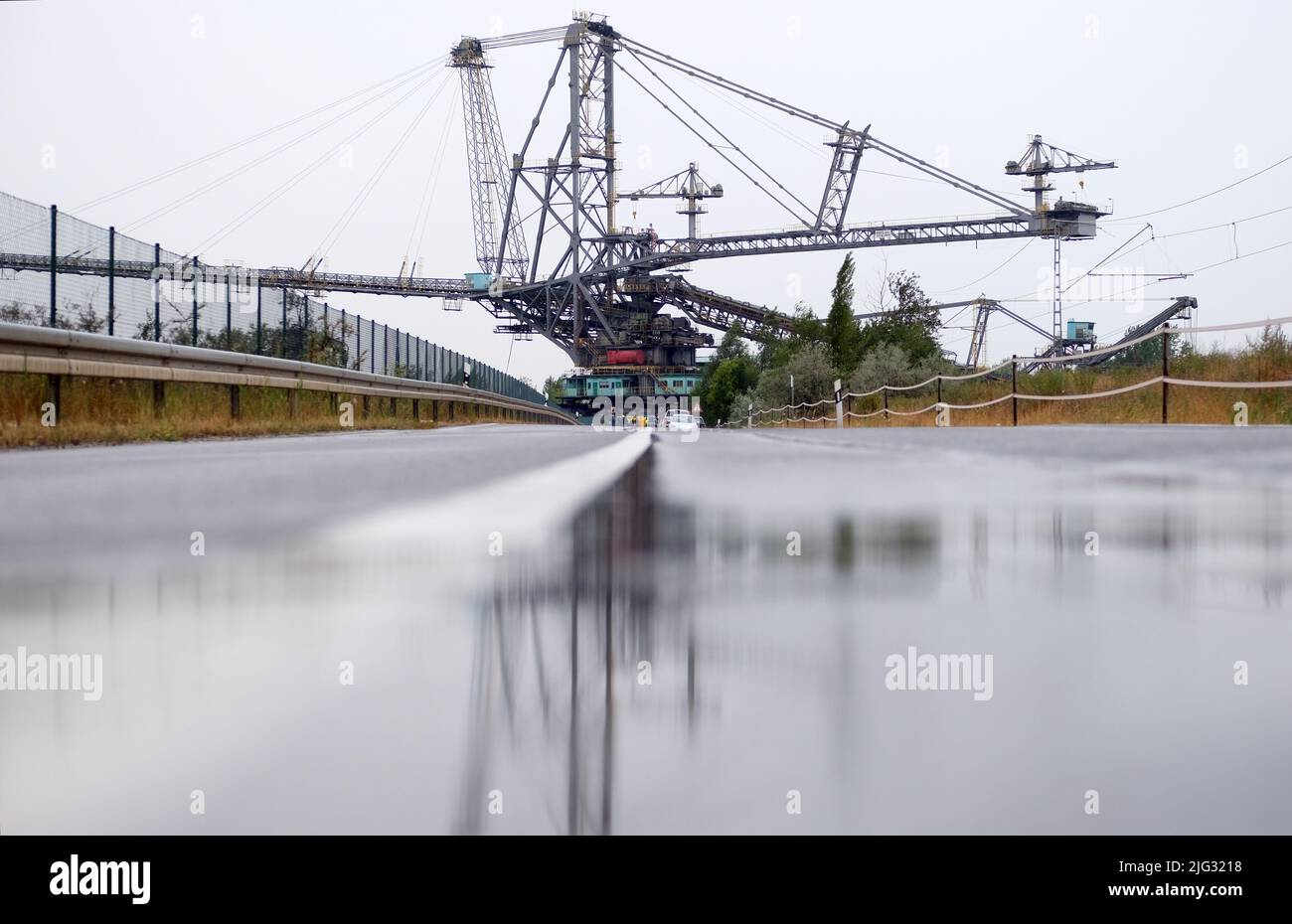 Profen, Germany. 07th July, 2022. A large open pit mining machine ...