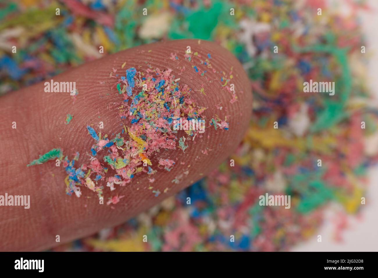 Finger close-up with traces of plastic and microplastic, environmental ...