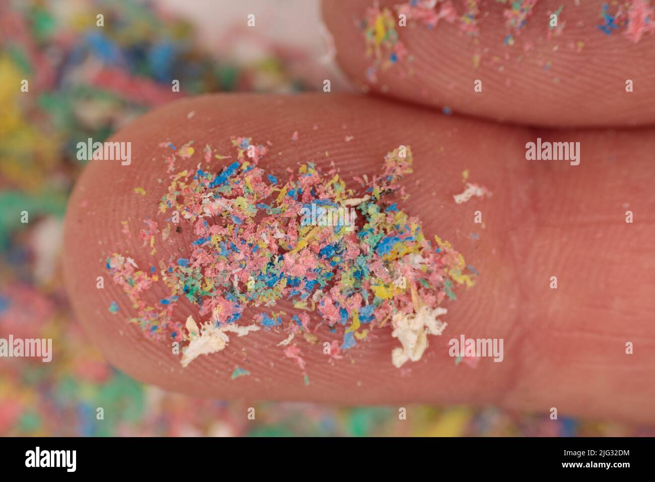 Small micro plastic granules on finger, close-up . Sea pollution Stock ...