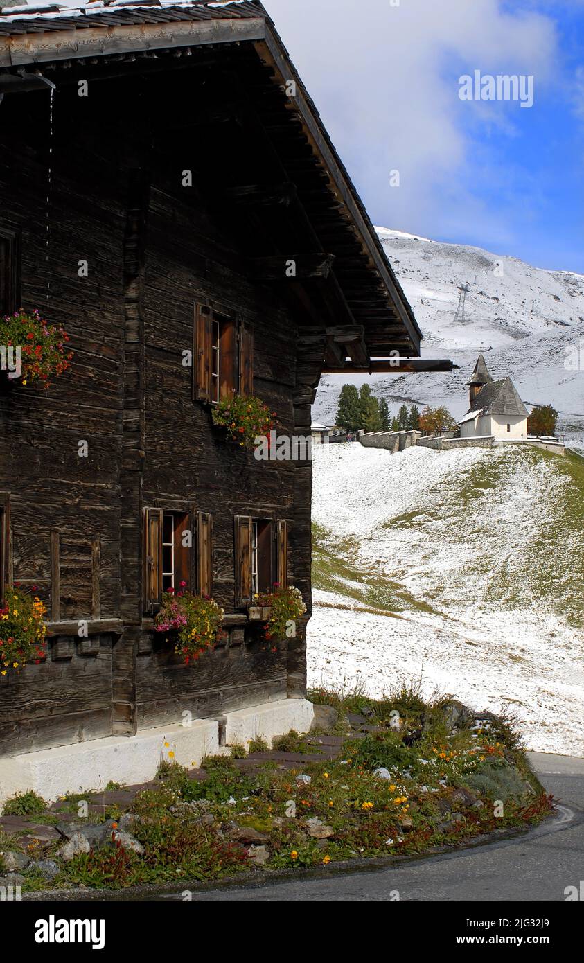 typical Swiss wooden house in a autumn landscape at the small mountain ...
