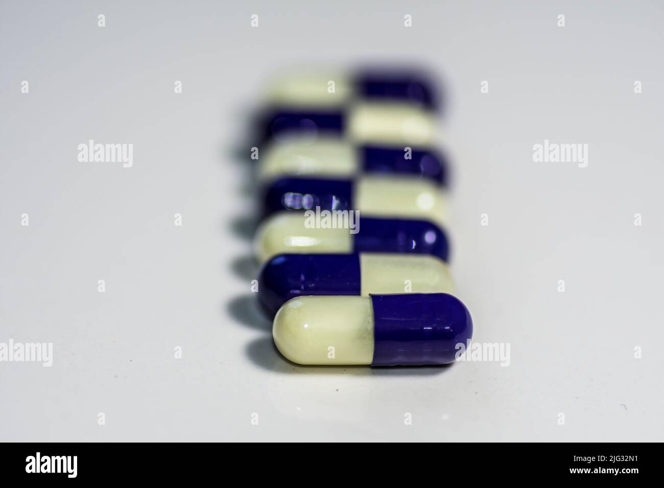 Row of capsules, medicine isolated on white with copy space Stock Photo ...